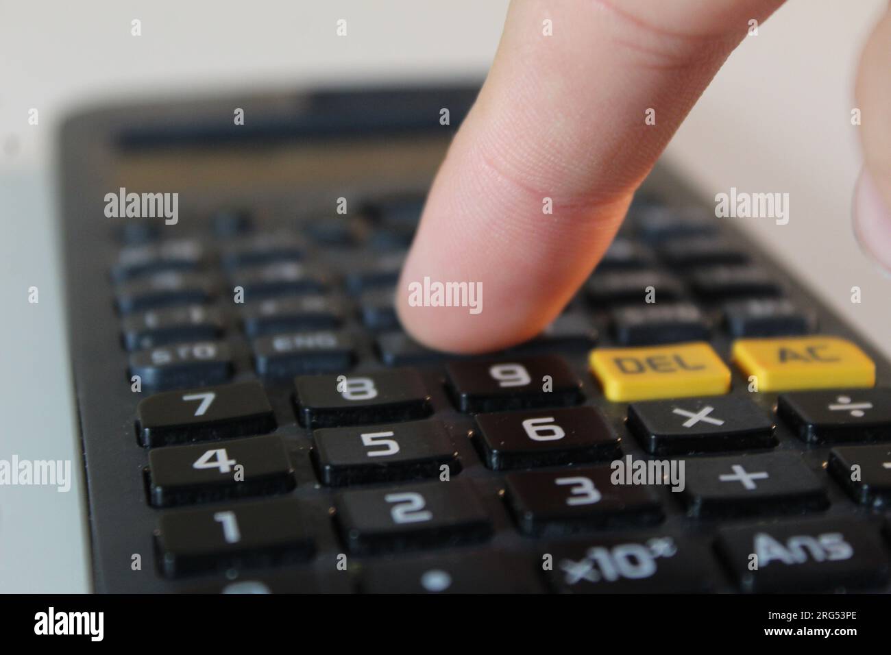 Using a calculator hi-res stock photography and images - Alamy