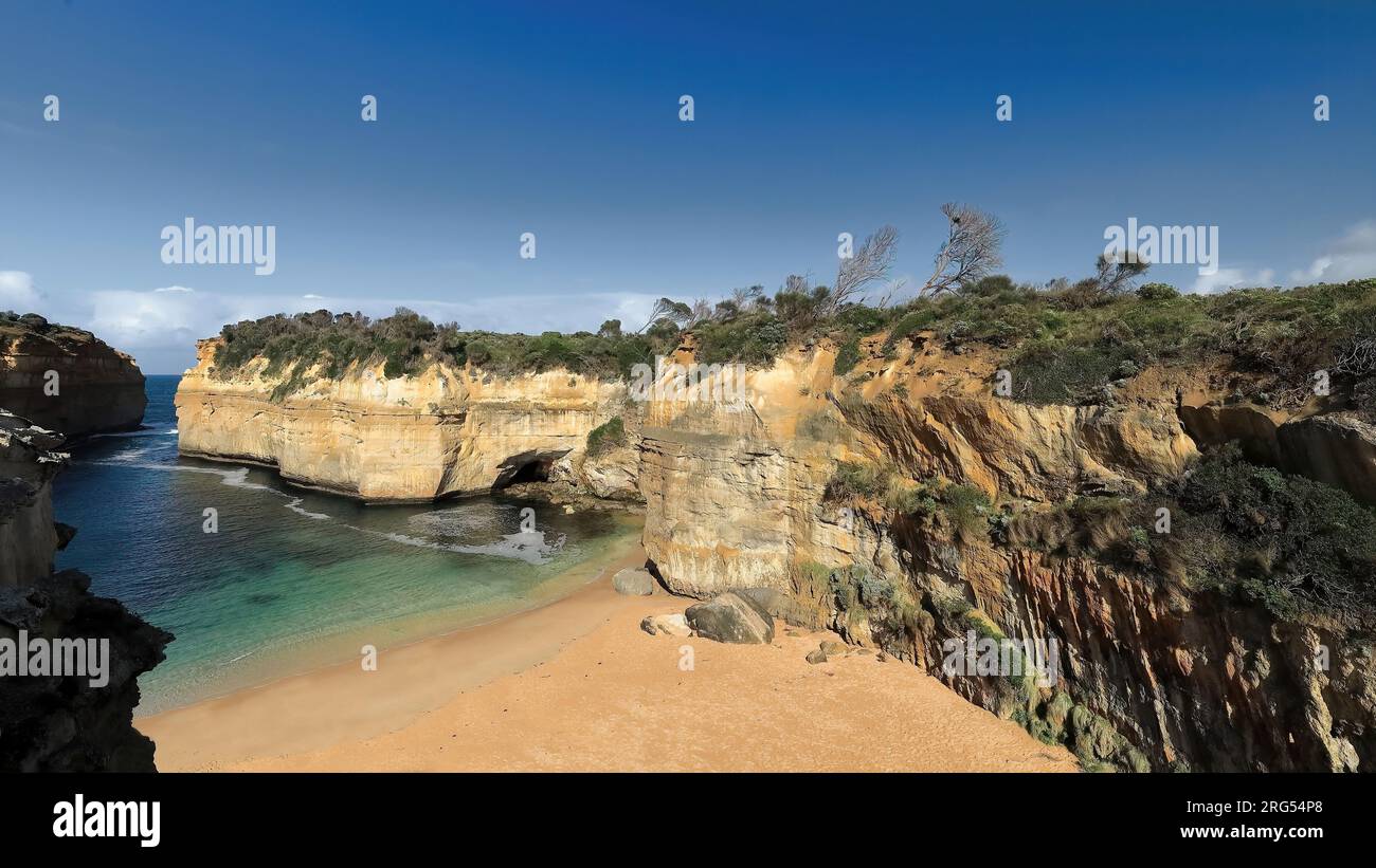 823 Western cliffs frame the beach at the bottom of Loch Ard Gorge ...