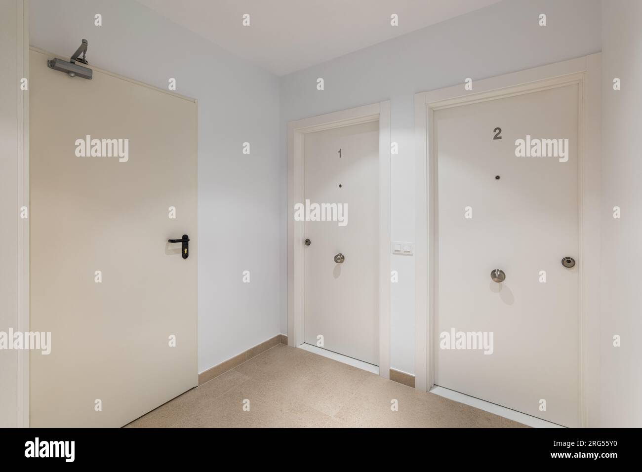 Hall space with two entrance doors to apartments or hotel rooms with ...