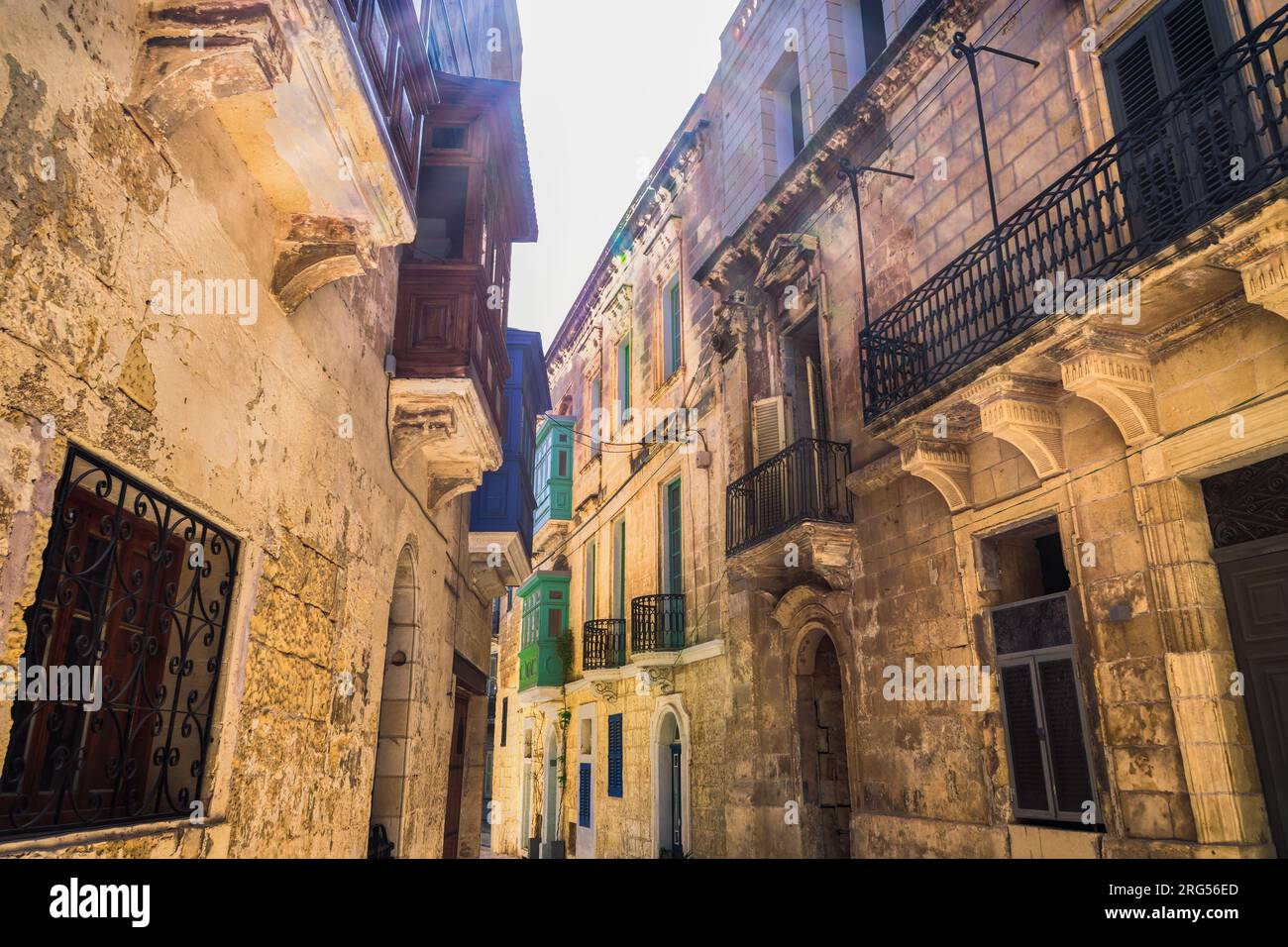 Traditional Maltese limestone buildings with coloured balconies in the ...