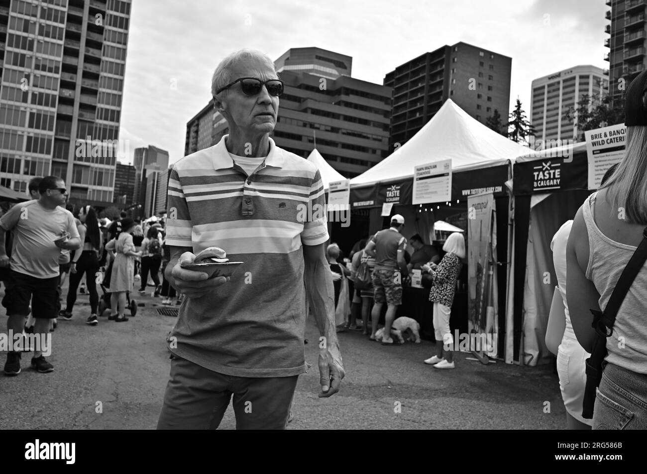 BLACK AND WHITE. 2023 Taste of Calgary food festival. A senior male ...