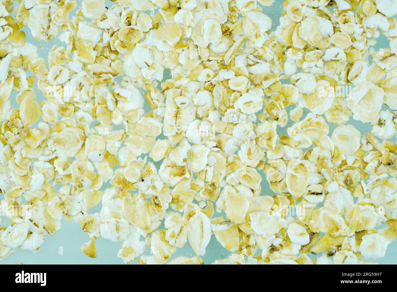 Oatmeal is a whole grain cereal product made from seed oats Stock Photo ...