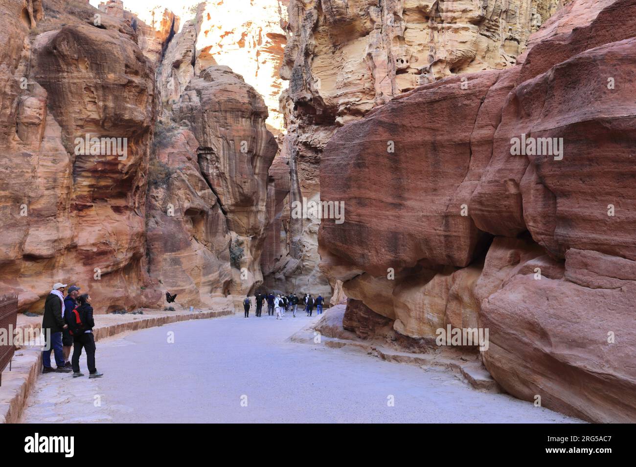 People walking along the Al-Siq, the Main Entrance Canyon to Petra ...