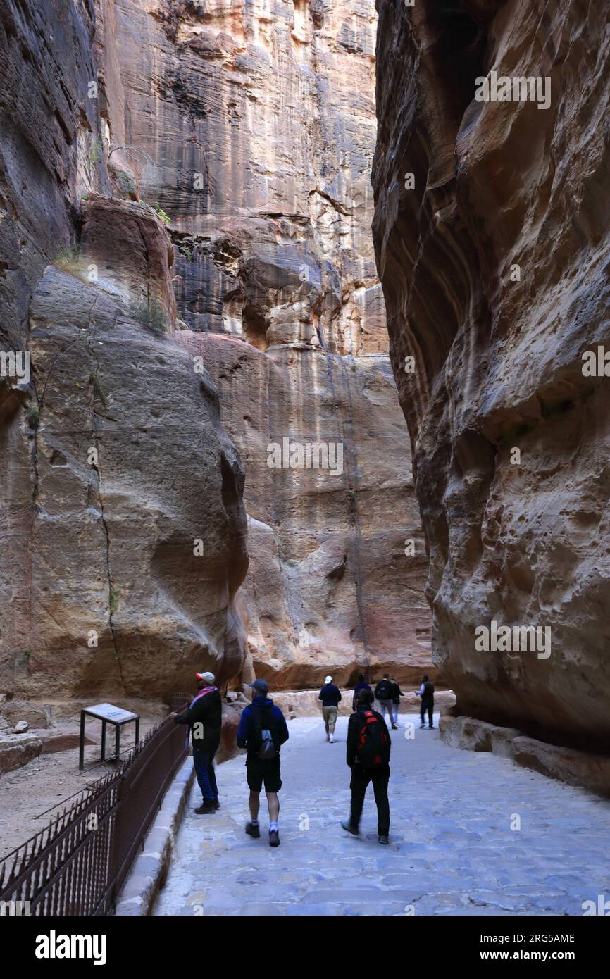 People walking along the Al-Siq, the Main Entrance Canyon to Petra ...