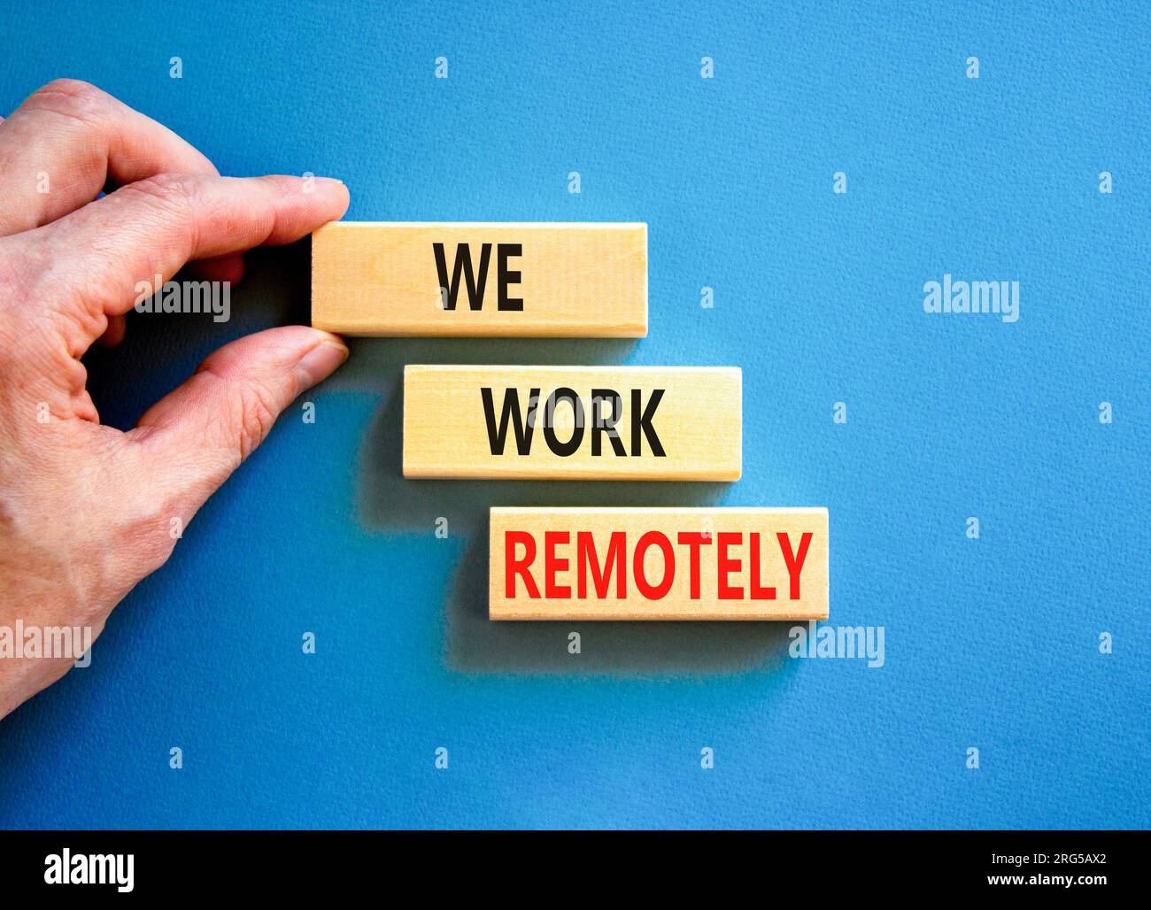 We work remotely symbol. Concept words We work remotely on wooden block ...