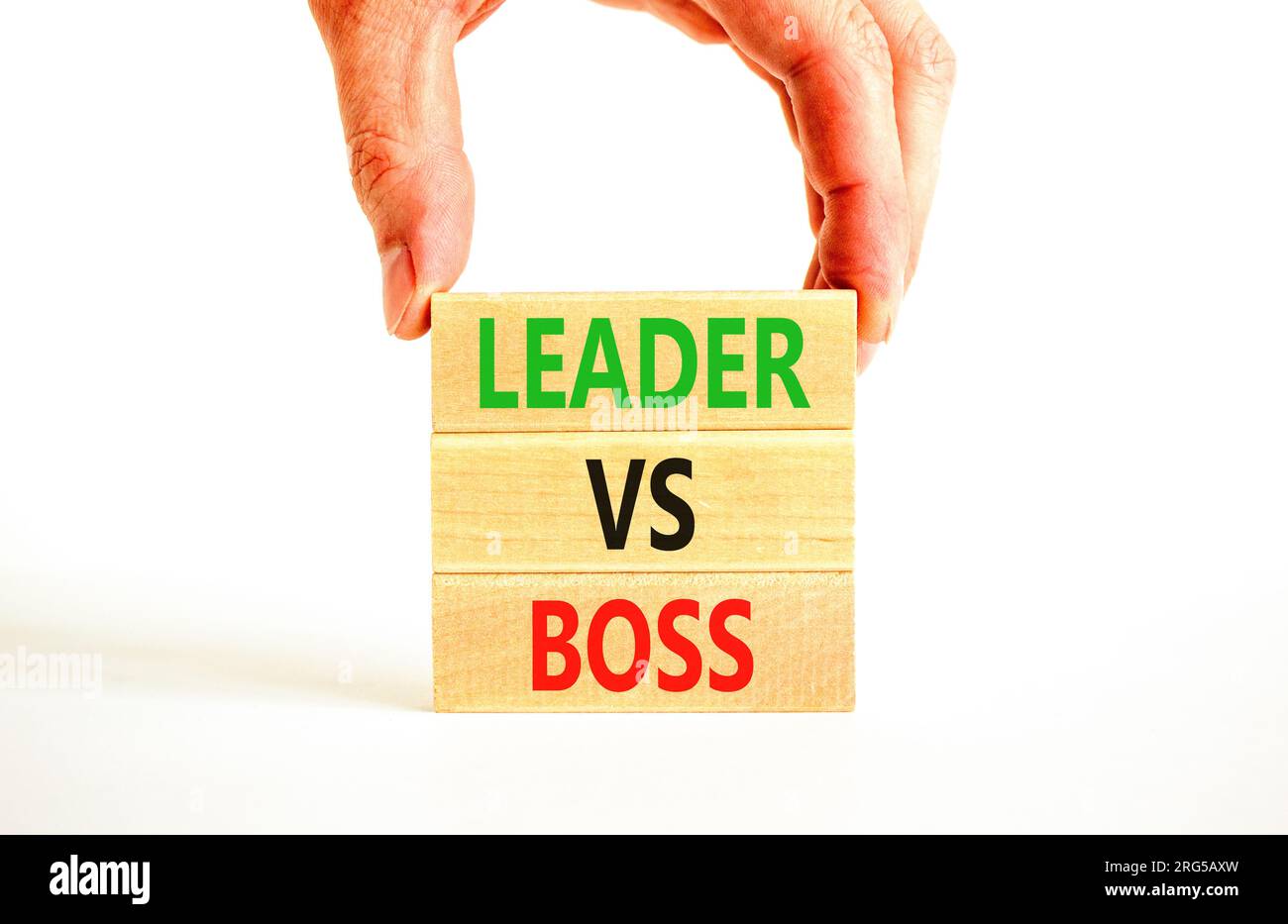 Boss vs leader symbol. Concept words Boss vs versus leader on wooden ...