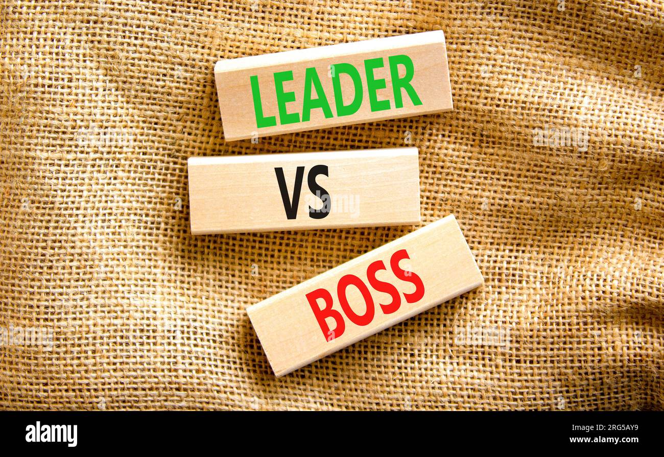 Boss vs leader symbol. Concept words Boss vs versus leader on wooden ...