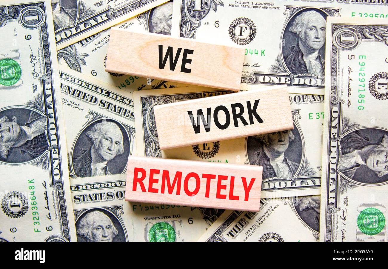 We work remotely symbol. Concept words We work remotely on wooden block ...