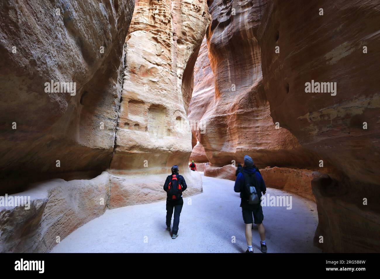 People walking along the Al-Siq, the Main Entrance Canyon to Petra ...