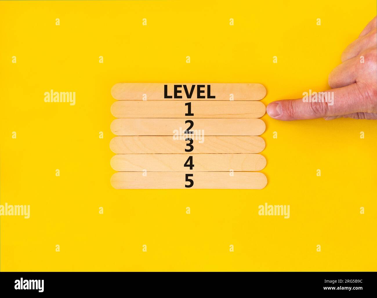 Time to level 1 symbol. Concept word Level 1 2 3 4 5 on wooden sticks ...