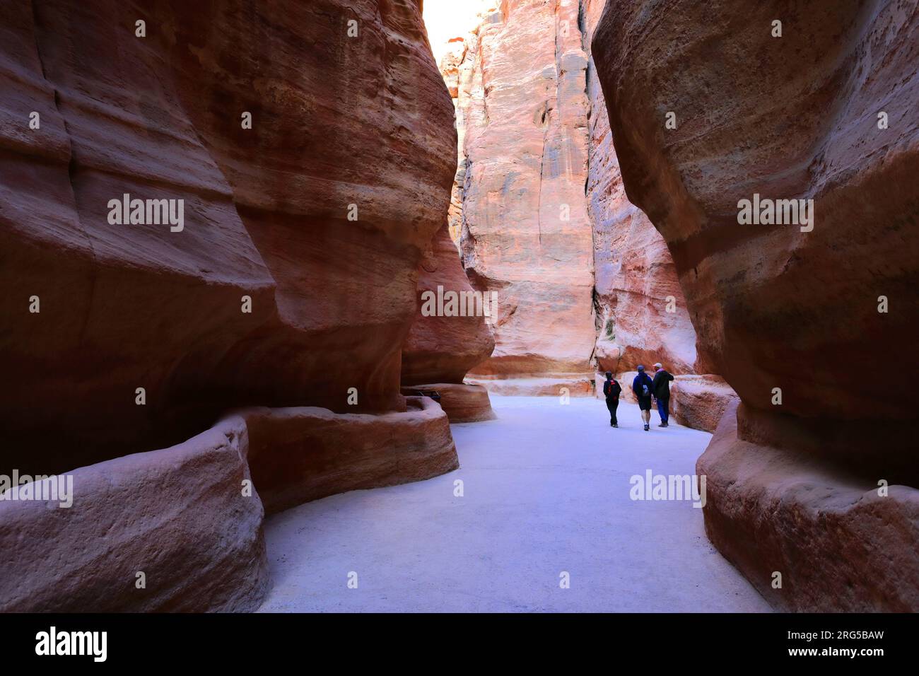People walking along the Al-Siq, the Main Entrance Canyon to Petra ...