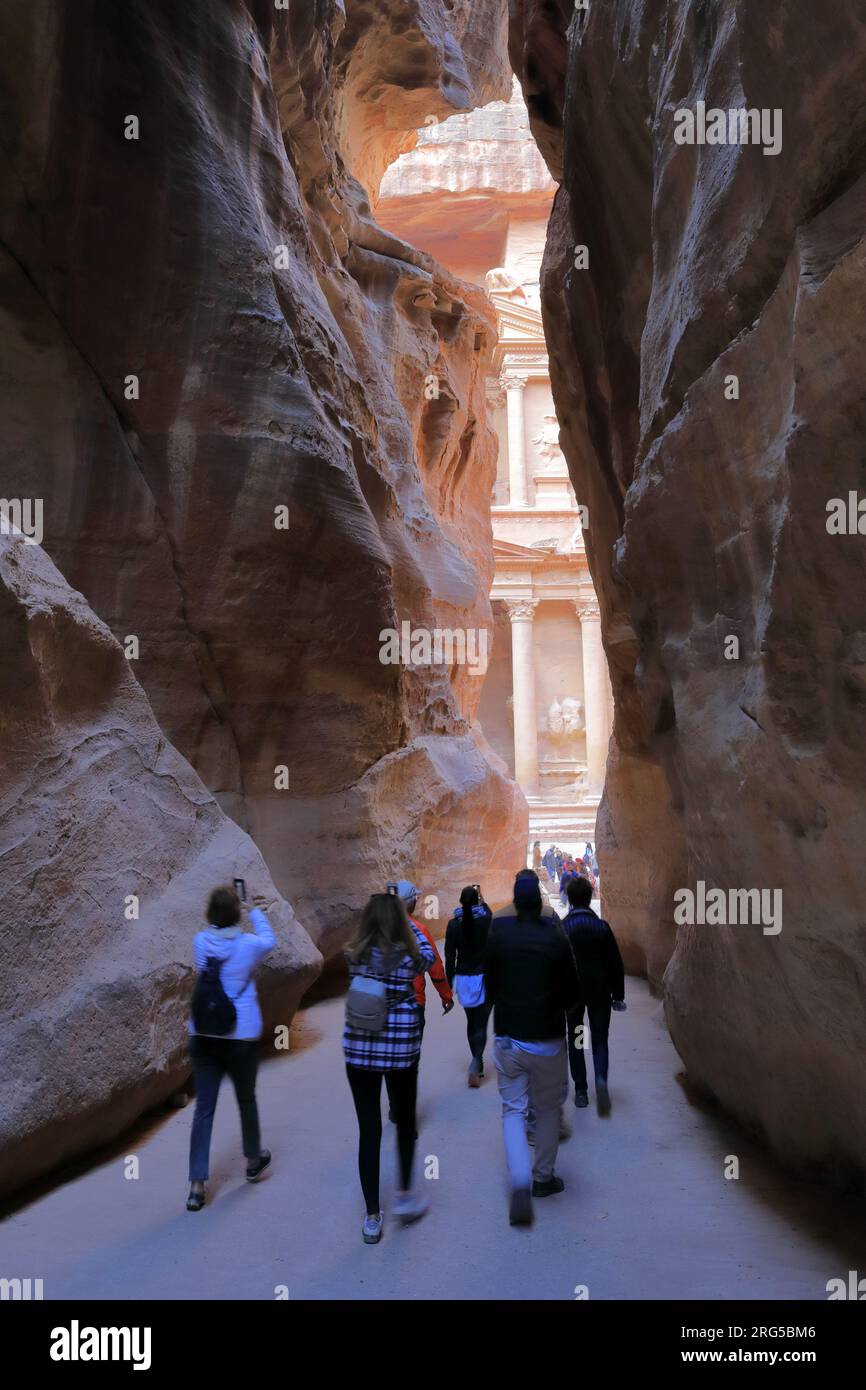 People walking along the Al-Siq, the Main Entrance Canyon to Petra ...