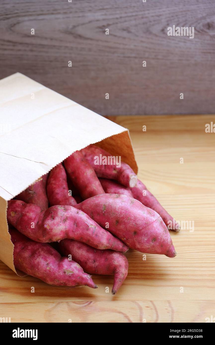 Heap of Raw Sweet Potatoes Scattered from Paper Bag Stock Photo - Alamy