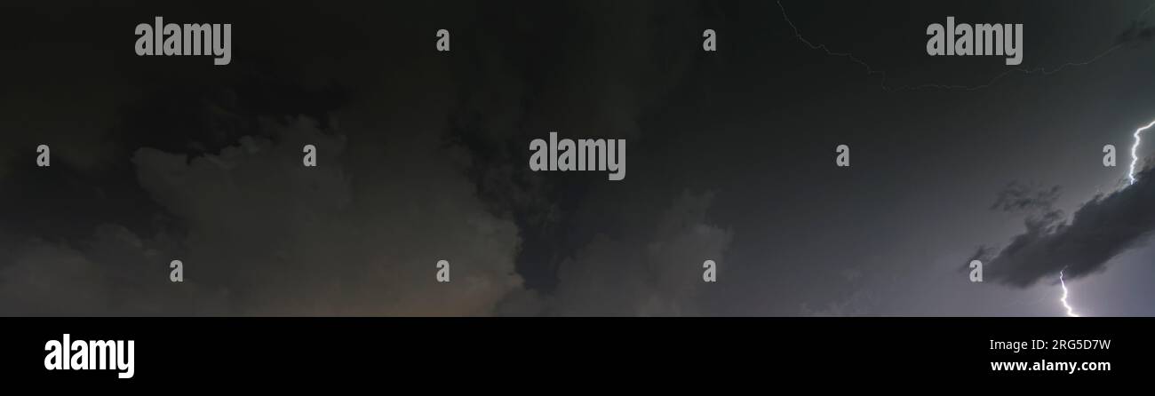 Picture of a flash in the night sky with glowing clouds in summer Stock ...
