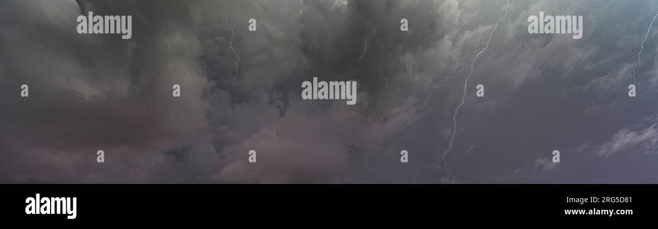 Picture of a flash in the night sky with glowing clouds in summer Stock ...