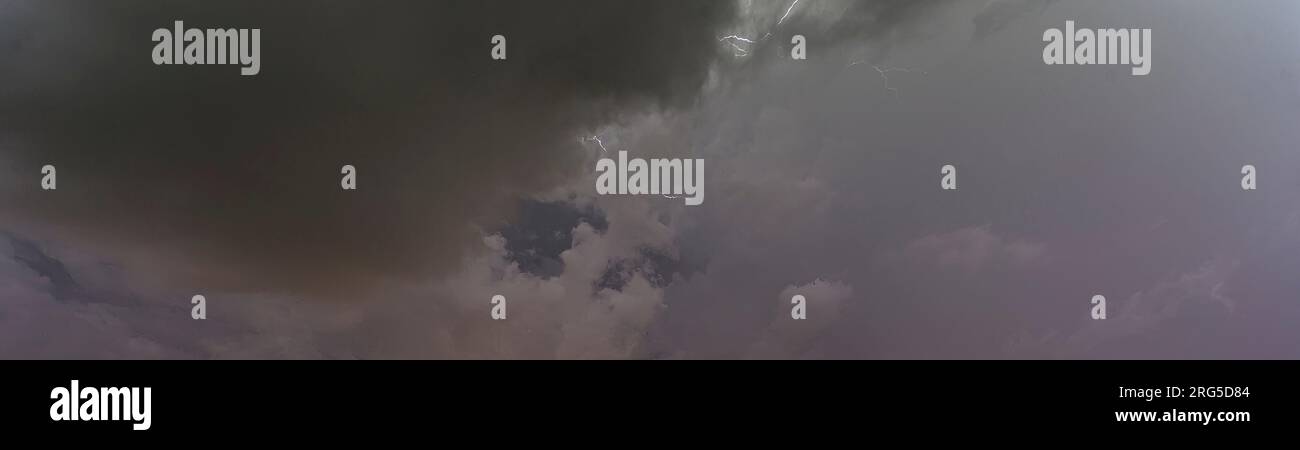 Picture of a flash in the night sky with glowing clouds in summer Stock ...