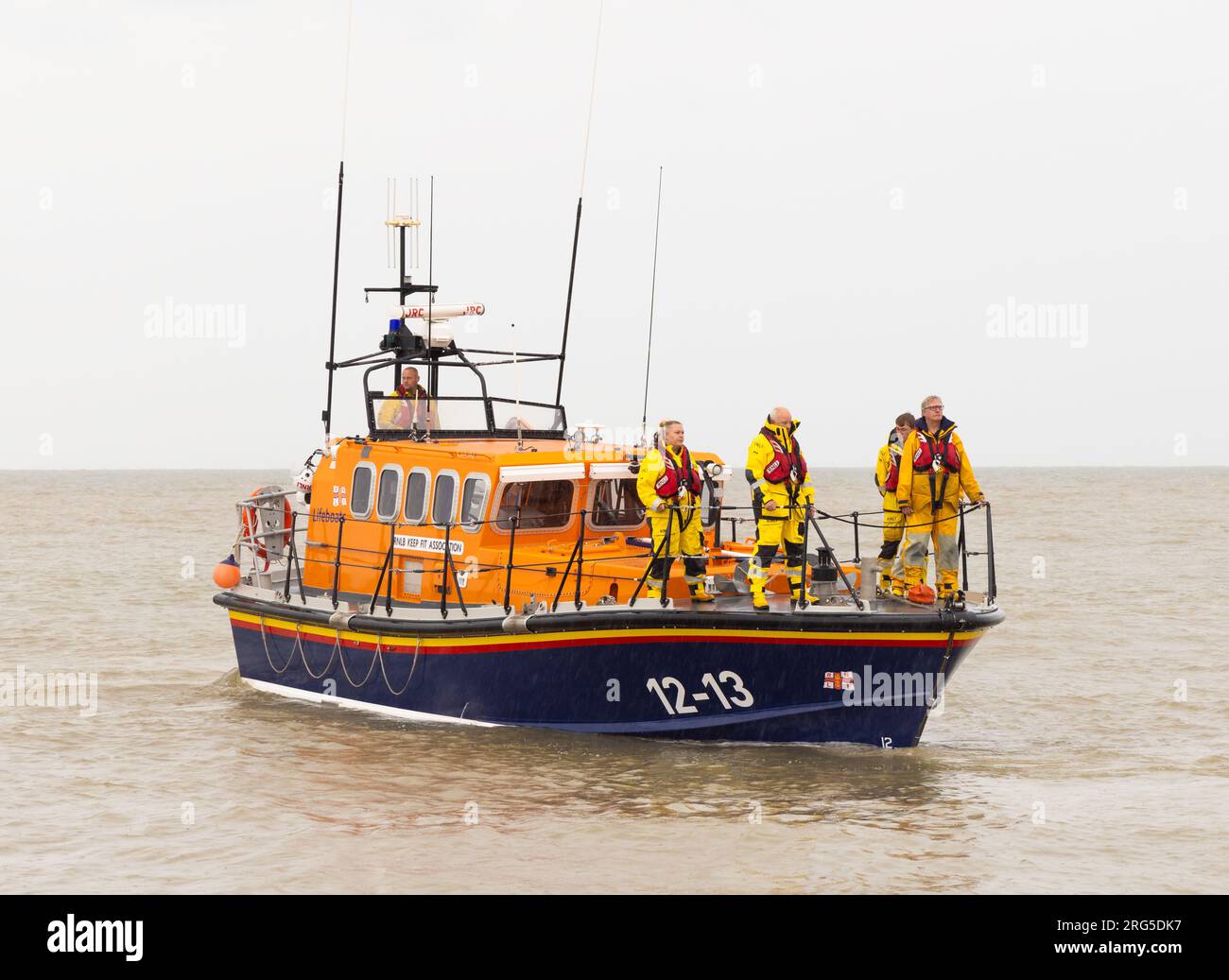 The Lifeboat crew standing on the bow of the Aldeburgh Lifeboat whilst ...