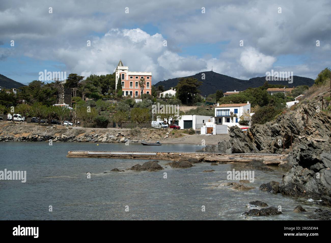 Seascape view of beach and village of Cadaques during summer on Costa ...
