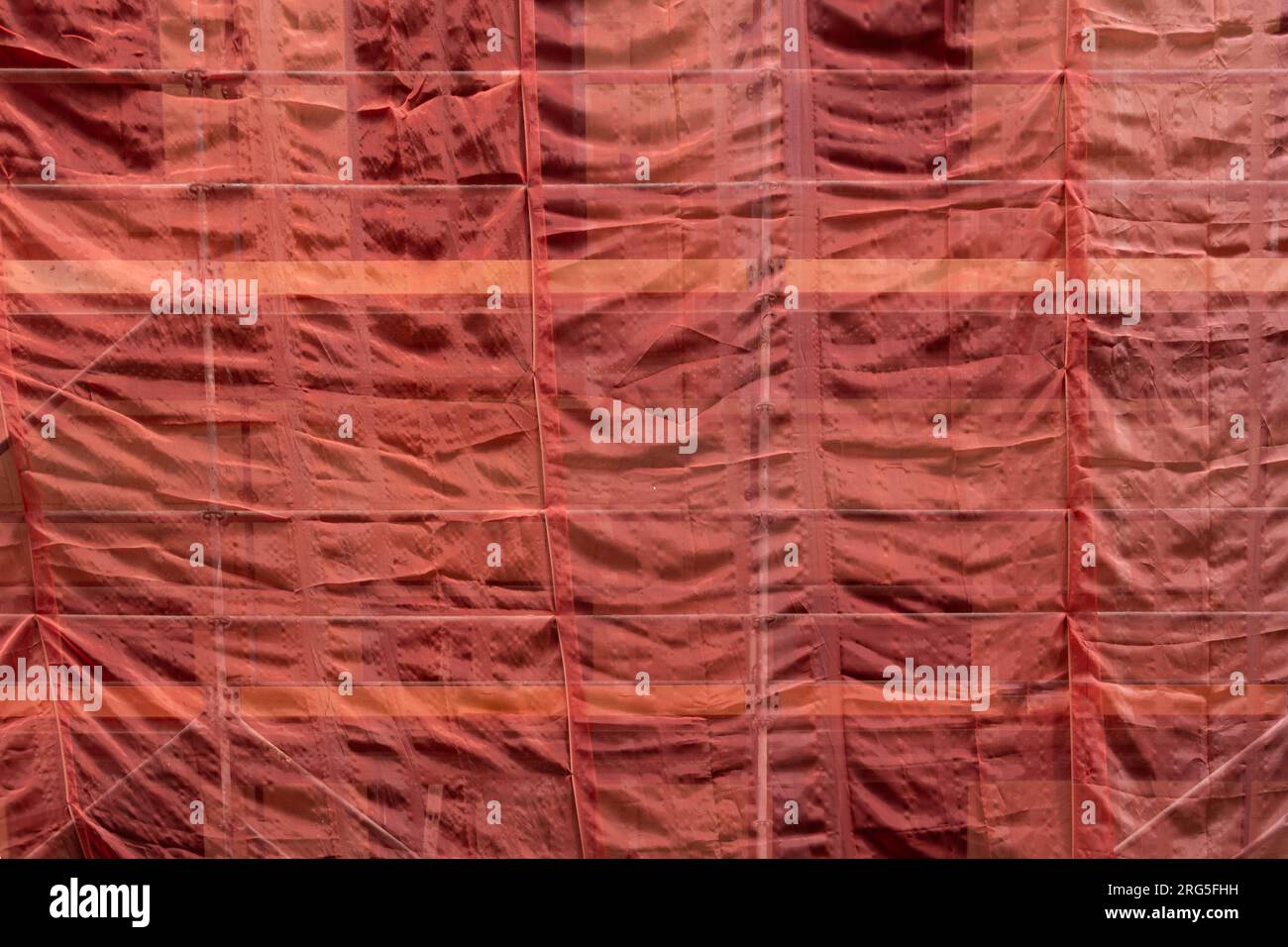 Colourful sheets of protective textile covers attached to the ...