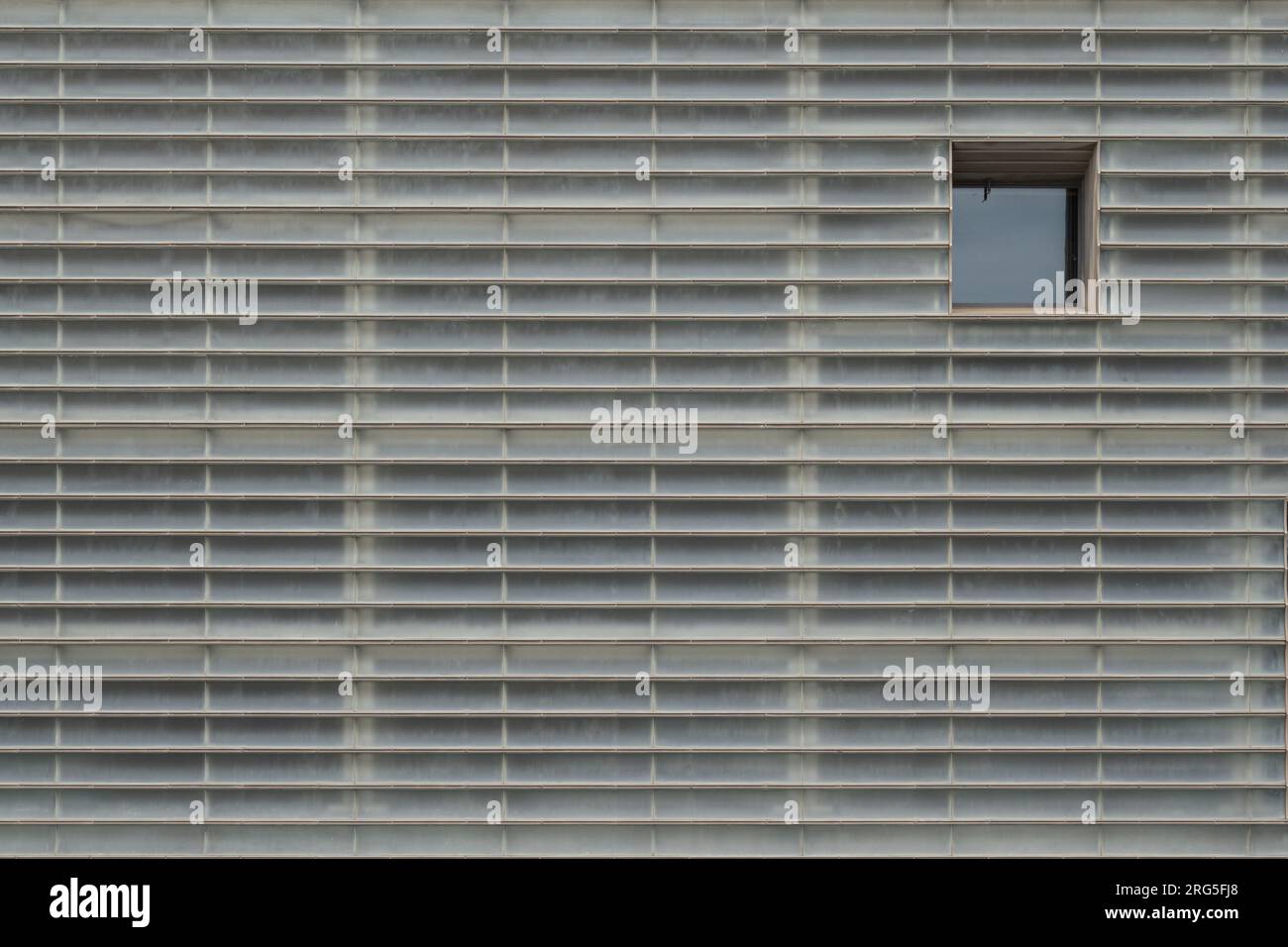 Exterior monochrome facade with horizontal beams and single window in ...
