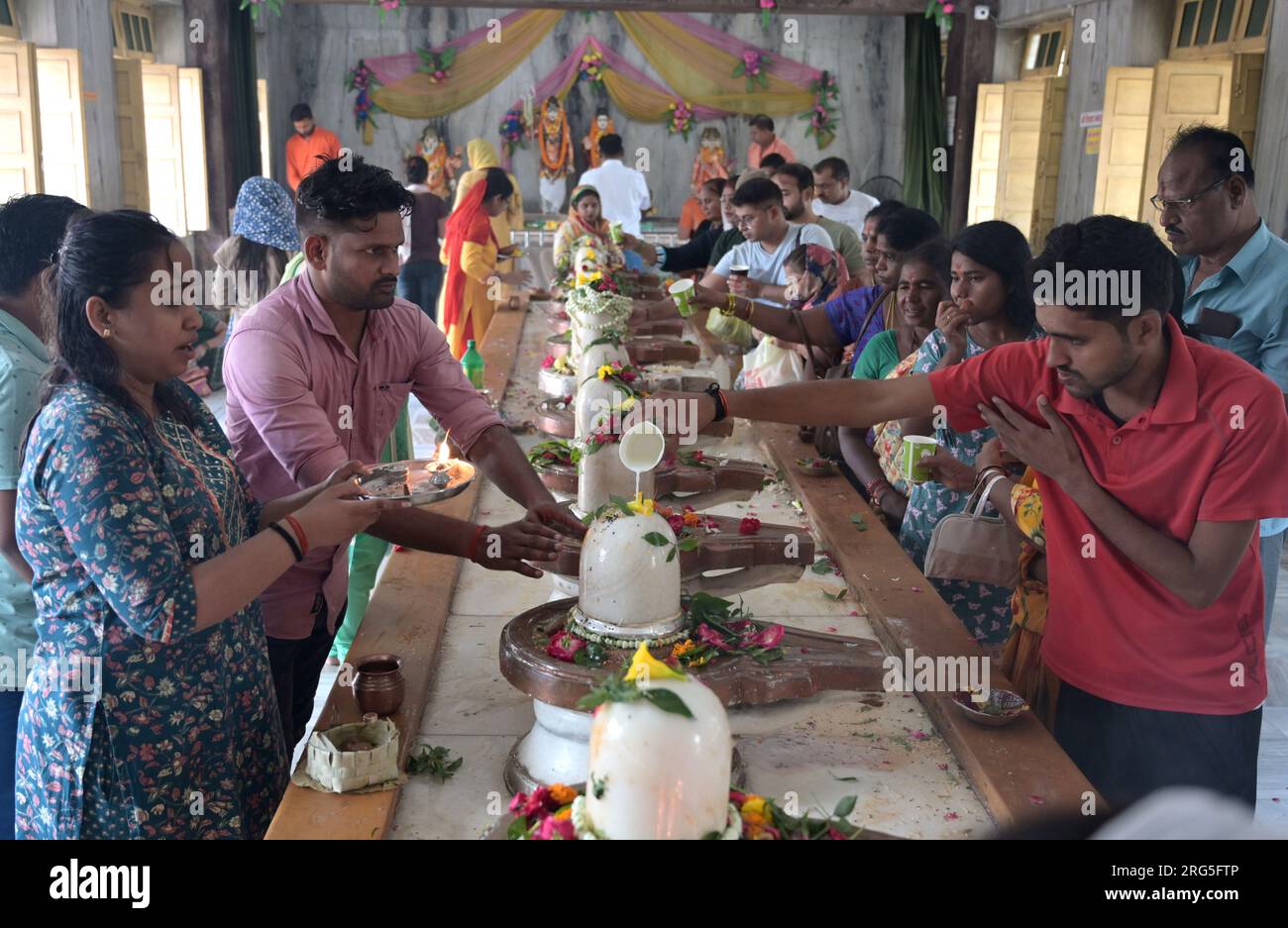 Devotees perform 'Abhishek' of Lord Shiva in the holy month of Shrawan ...