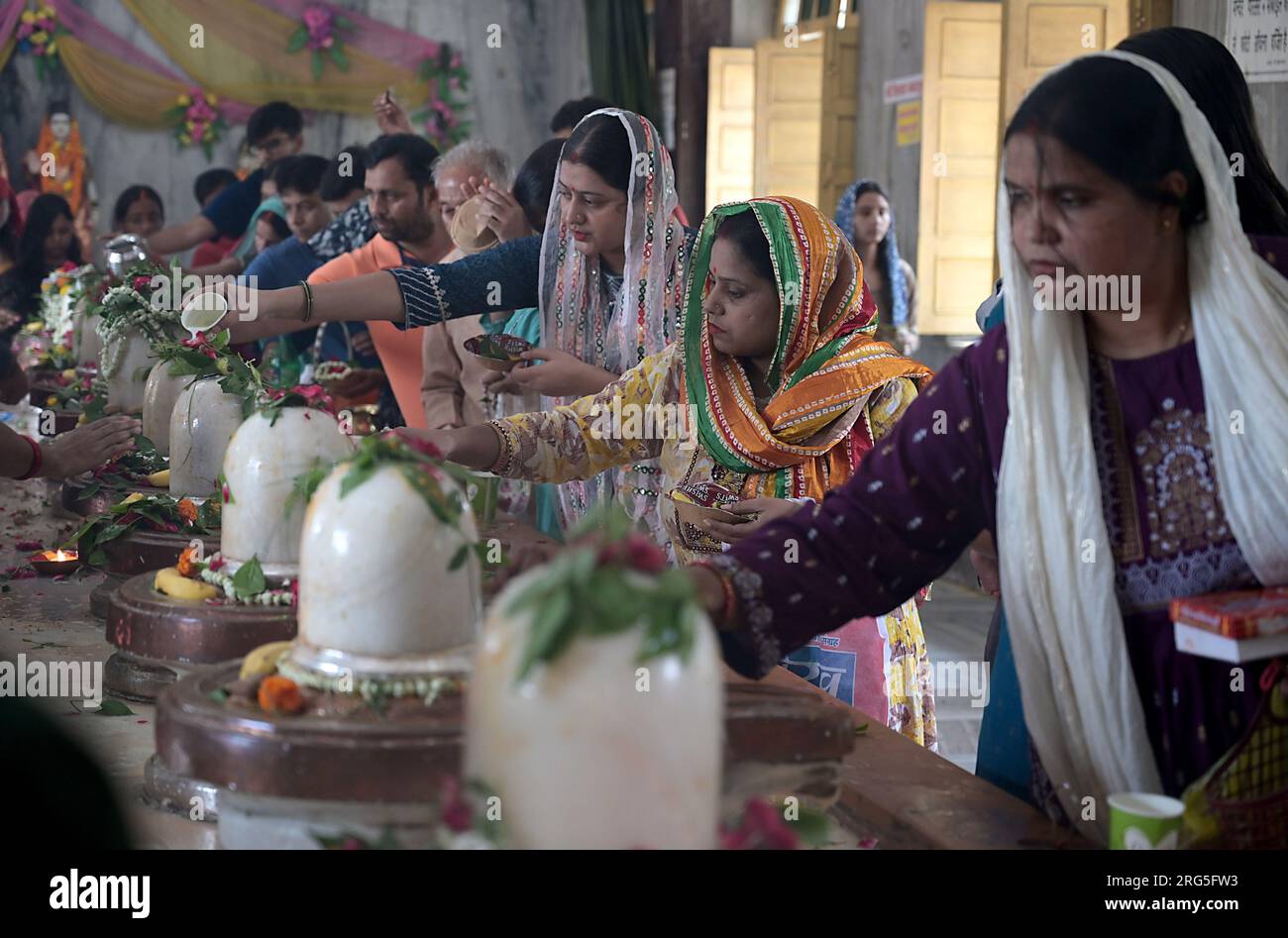Devotees perform 'Abhishek' of Lord Shiva in the holy month of Shrawan ...