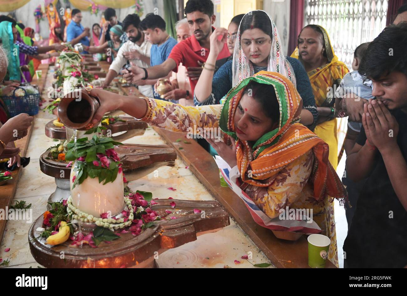 Devotees perform 'Abhishek' of Lord Shiva in the holy month of Shrawan ...
