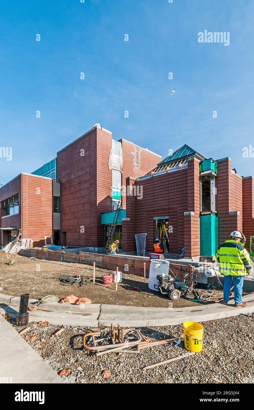 Construction workers and equipment at a building project construction ...