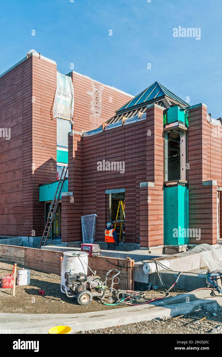 Construction workers and equipment at a building project construction ...