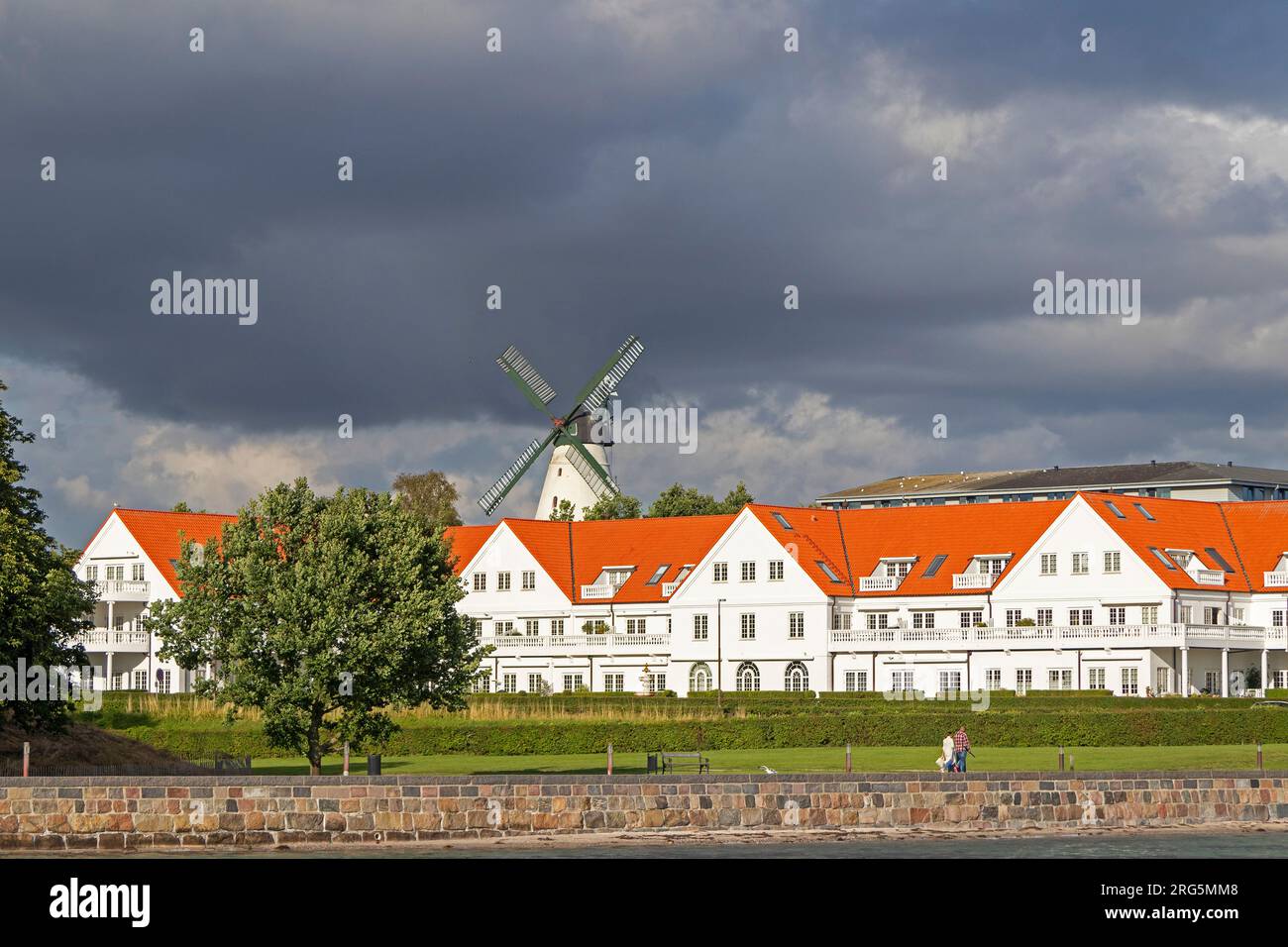 Windmill, houses, rain clouds, Sønderborg, Syddanmark, Denmark Stock ...