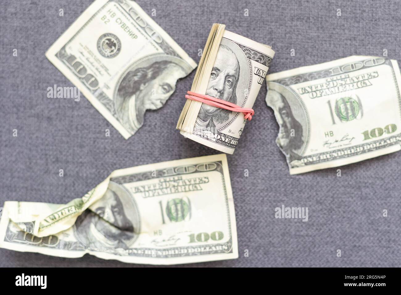 Dollars falling to the stack of dollars Stock Photo - Alamy