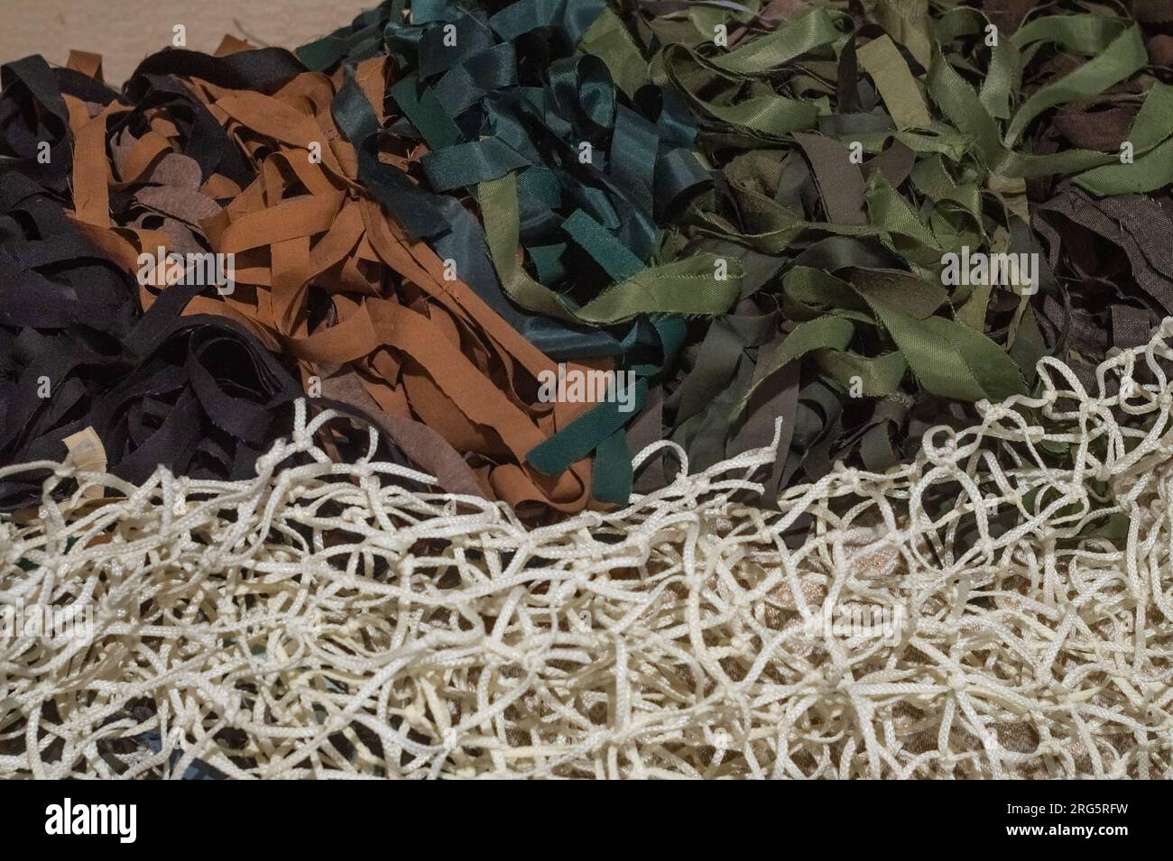 Materials for weaving camouflage nets from scraps of fabric to help the ...