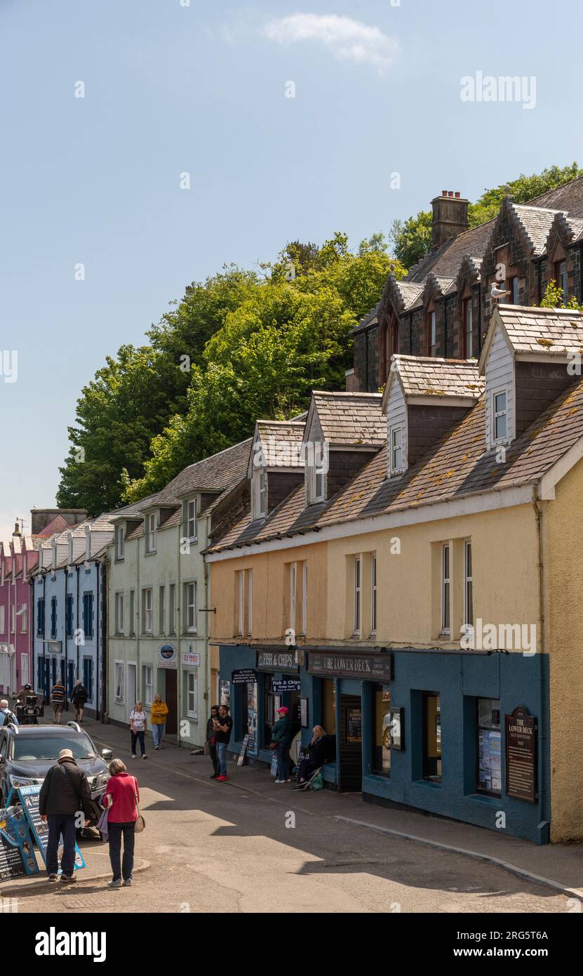 Portree, Isle of Skye, Scotland, UK. 5 June 2023. Colourful shops and houses on the harbour of ...