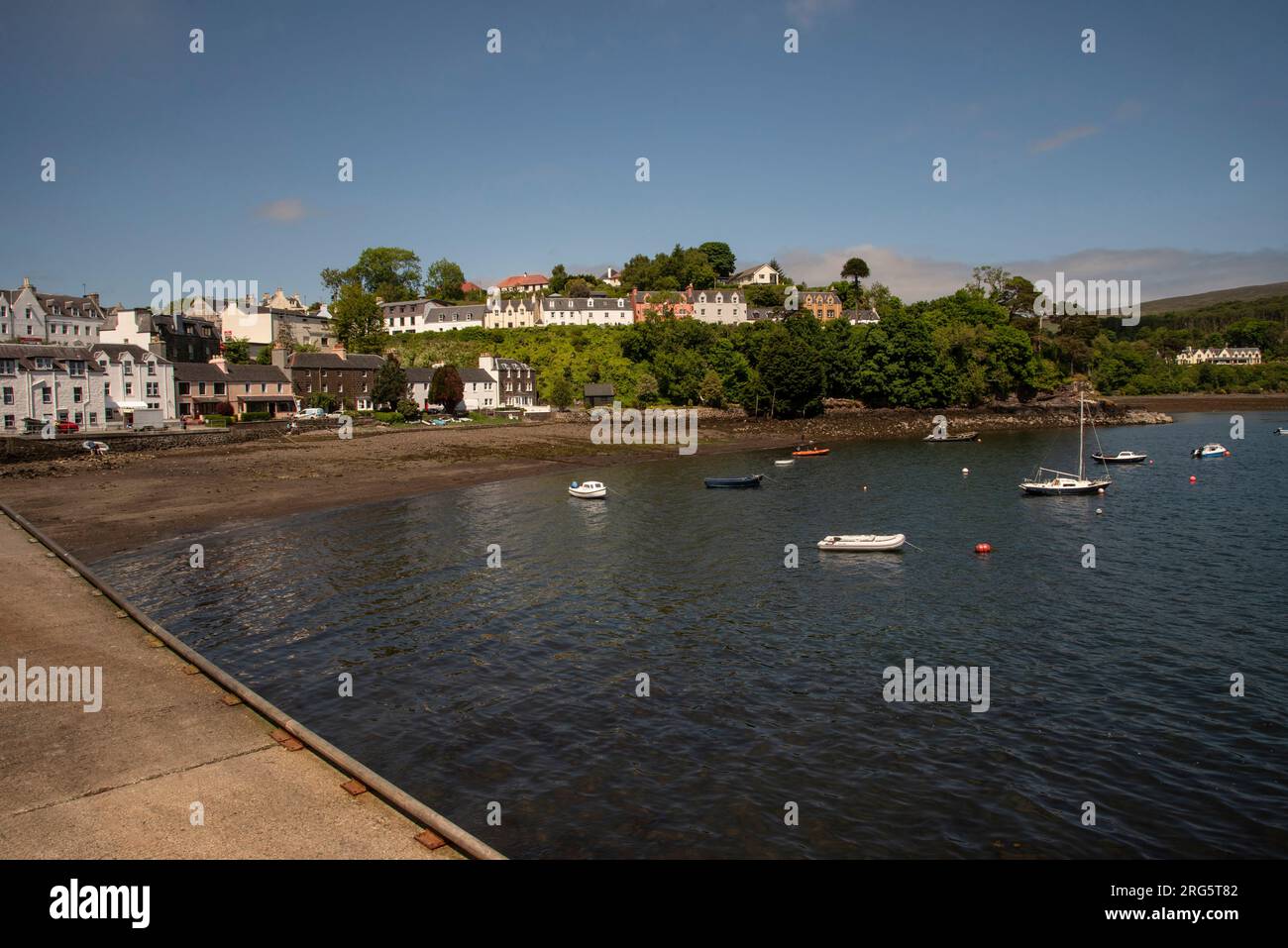 Portree, Isle of Skye, Scotland, UK. 5 June 2023. Colourful pproperties line the harbour wall in ...
