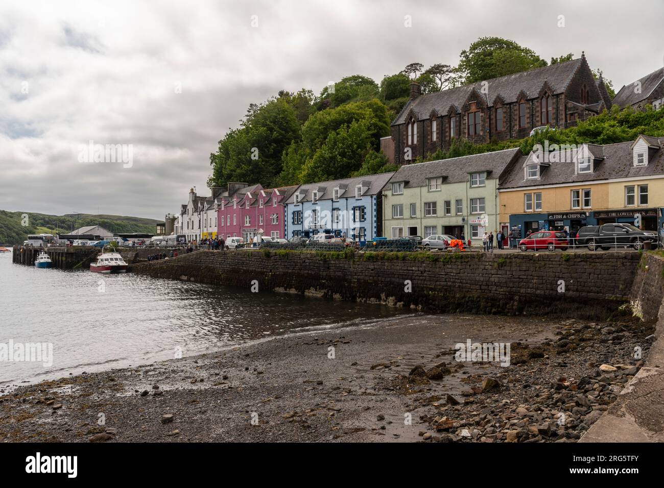 Portree, Isle of Skye, Scotland, UK. 5 June 2023. Colourful pproperties line the harbour wall in ...