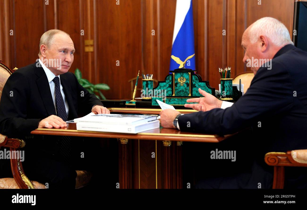 Moscow, Russia. 07th Aug, 2023. Russian President Vladimir Putin, left, listens to Rostec CEO ...