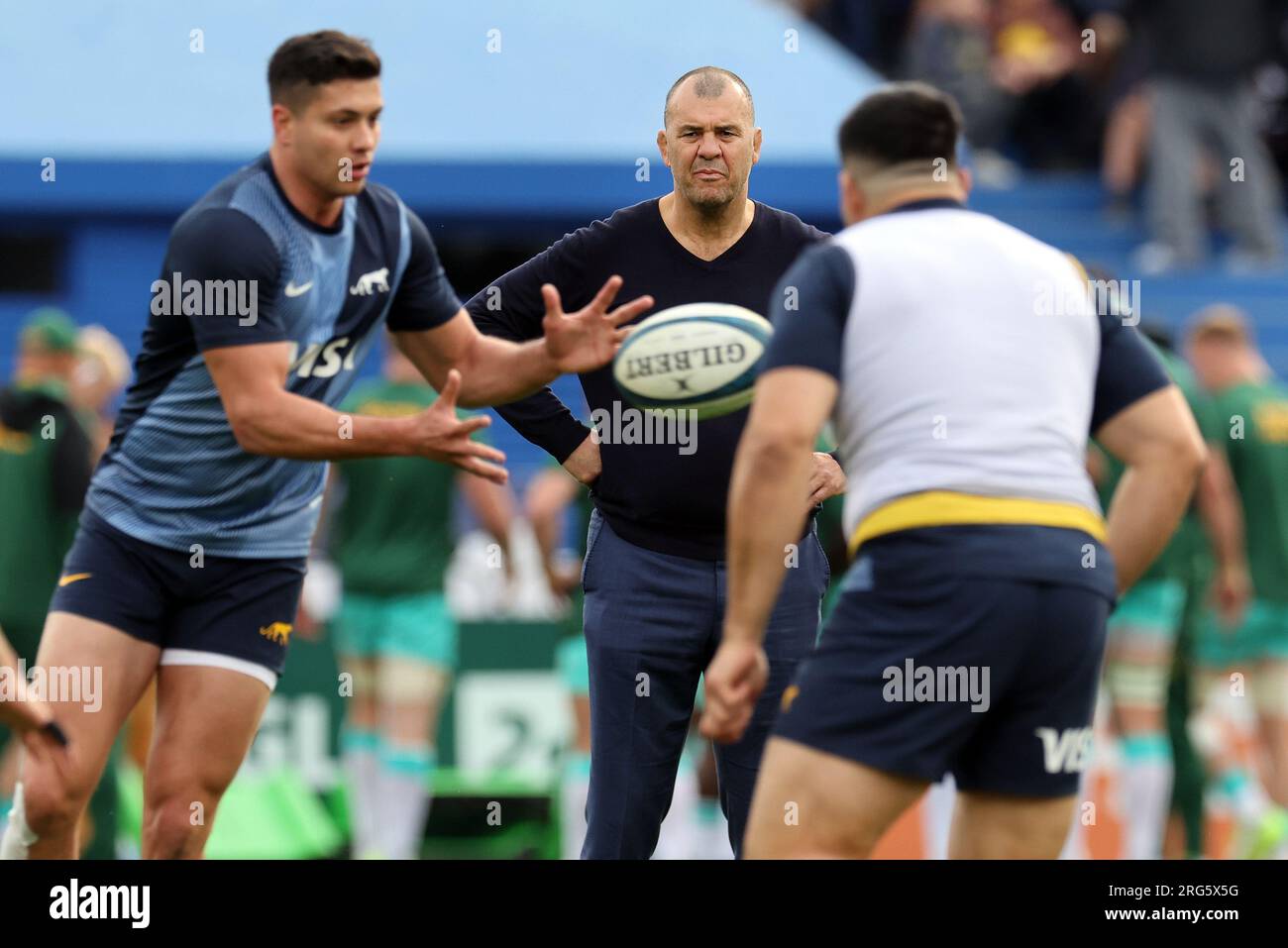 Argentina’s Los Pumas head coach Australian Michael Cheika (C) gestures during the warm-up of ...