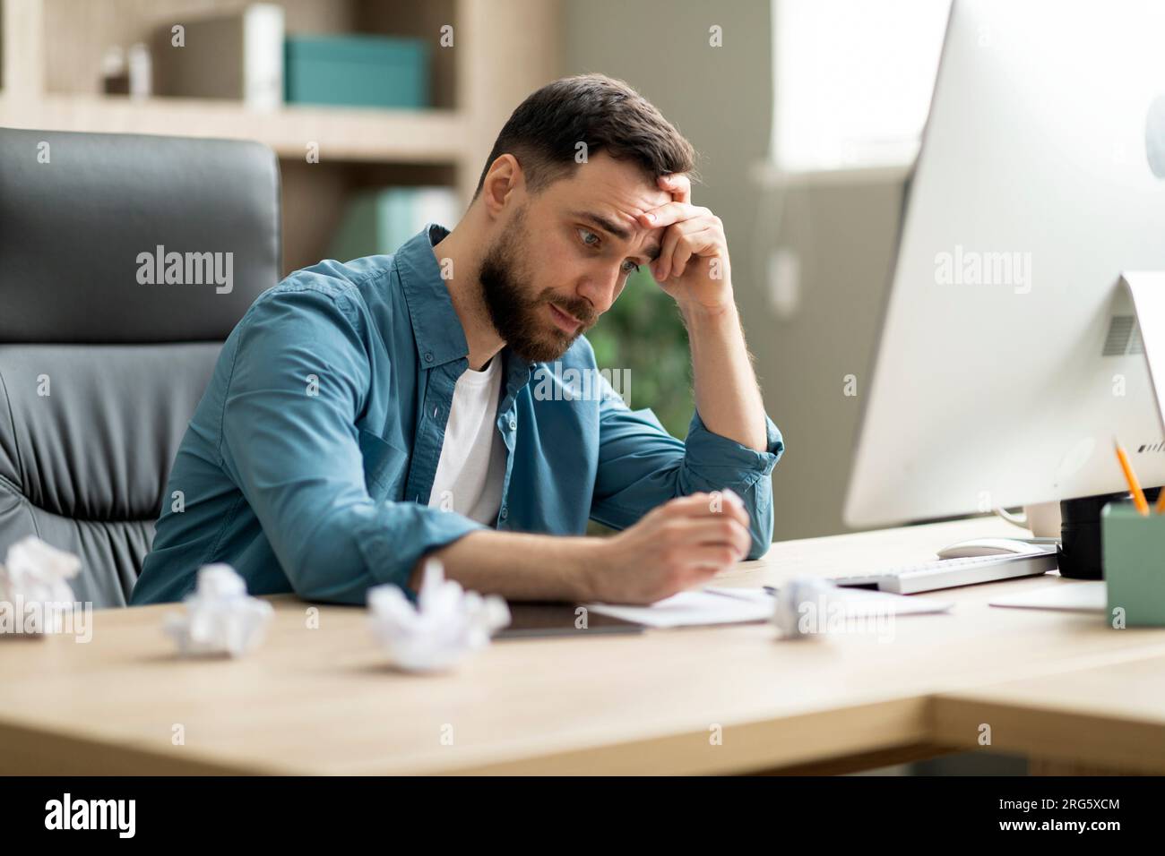 Depressed businessman crumpling paper hi-res stock photography and ...