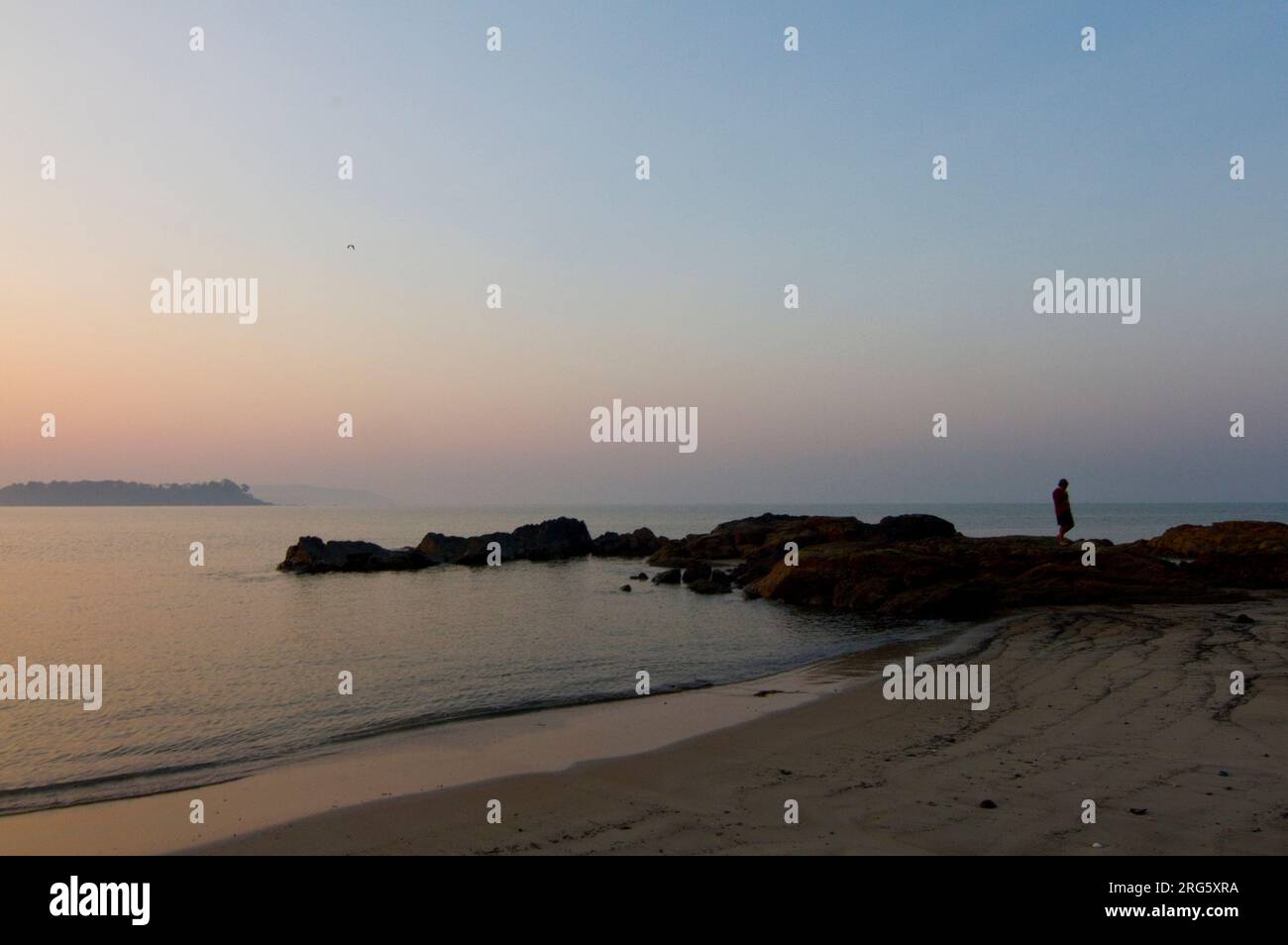 Beach scene at sunset, Goa, India Stock Photo - Alamy