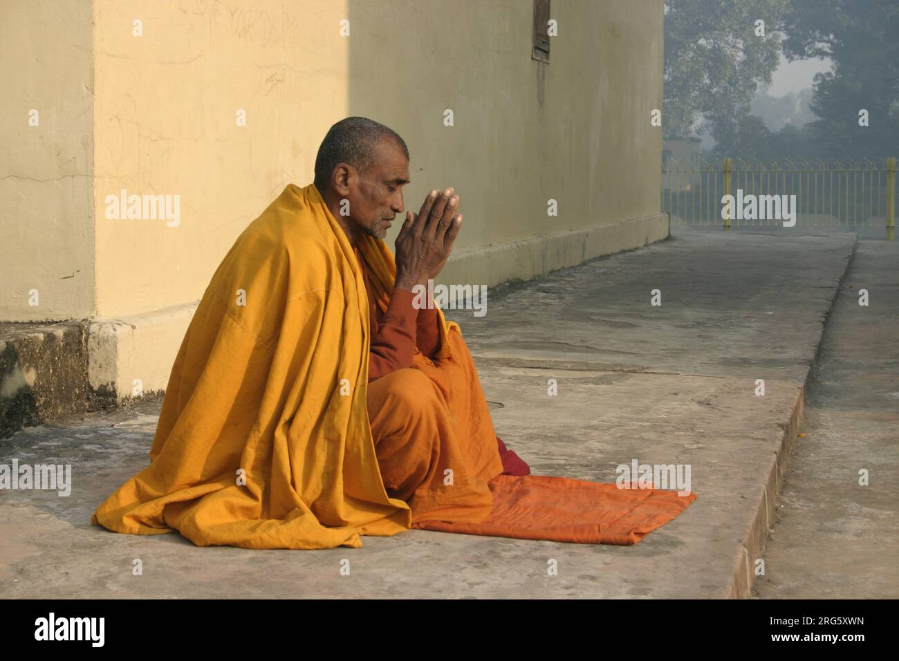 Praying monk, Kushinagar, Uttar Pradesh, India Stock Photo - Alamy