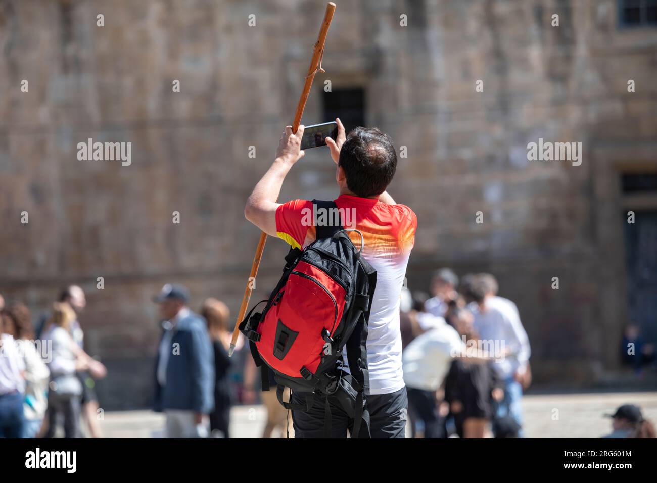 Pilgrims on the Camino de Santiago arrive at the Plaza del Obradoiro ...