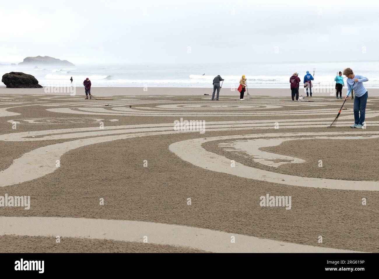 Circles in the Sand artists creating a sand labyrinth on Face Rock ...