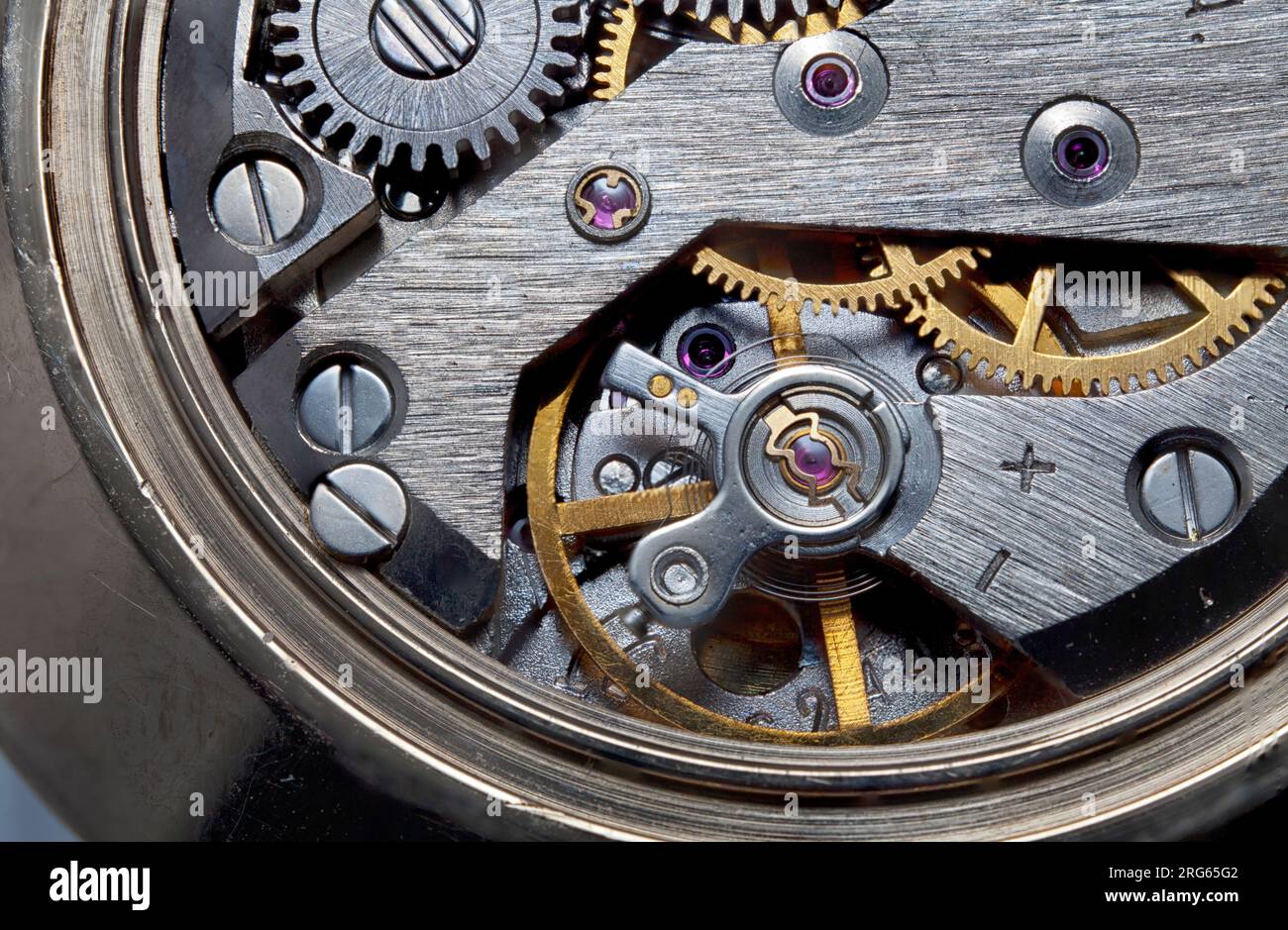 Macro image of the internal working of a pocket watch showing the ...