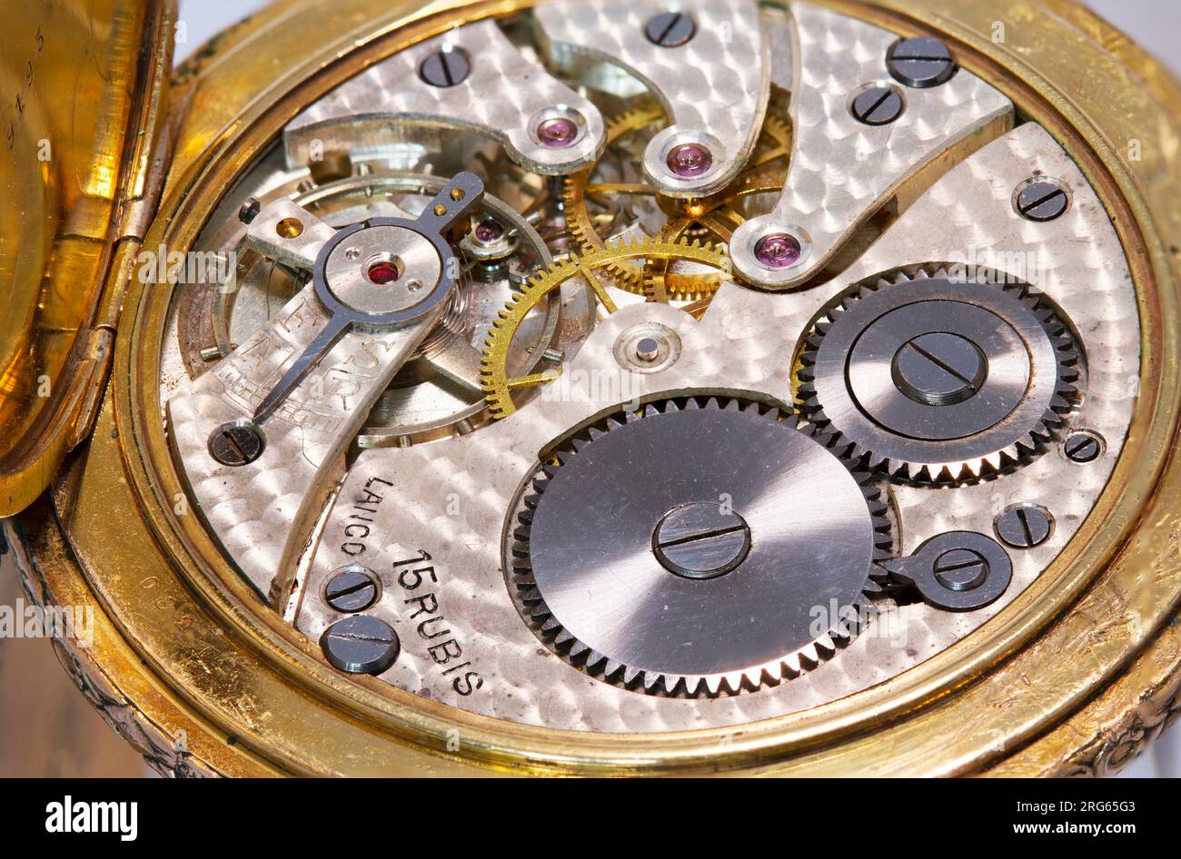 Macro image of the internal working of a pocket watch showing the ...