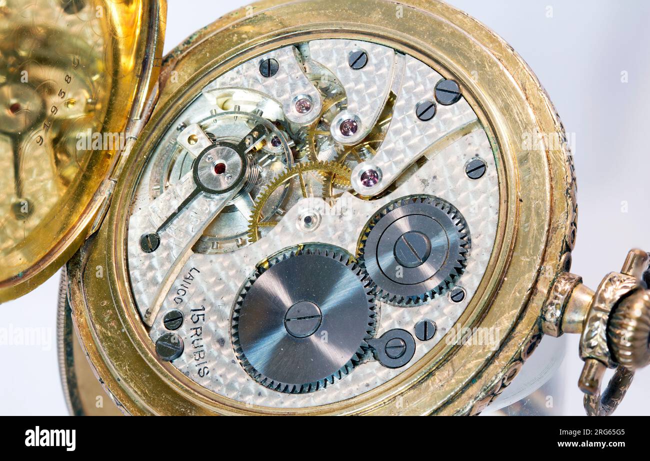 Macro image of the internal working of a pocket watch showing the ...