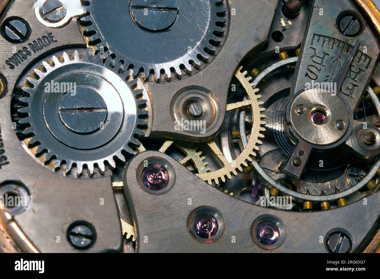 Macro image of the internal working of a pocket watch showing the ...