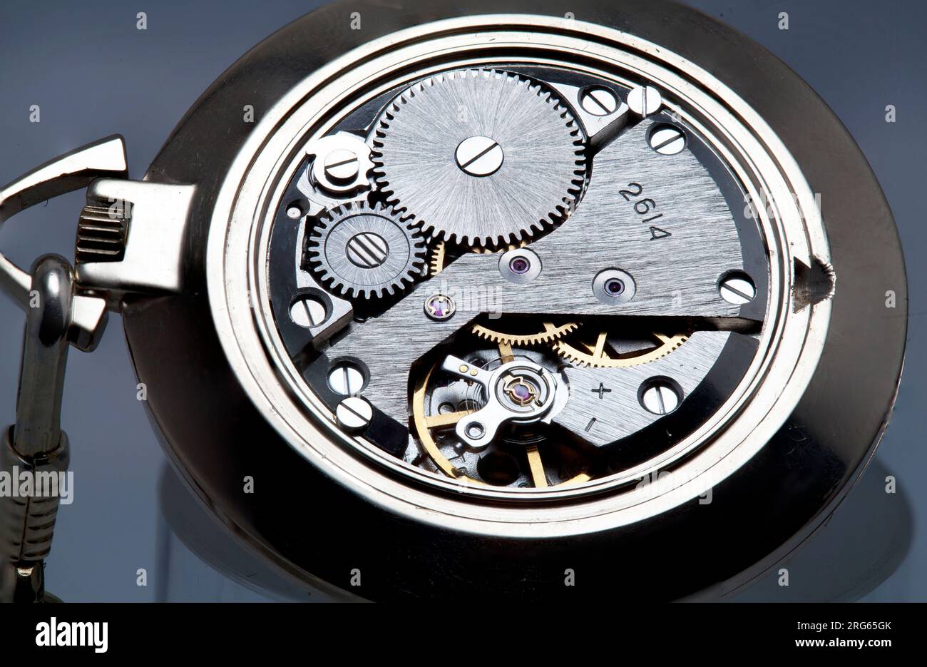 Macro image of the internal working of a pocket watch showing the ...