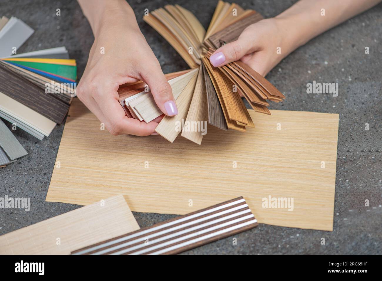 The designer chooses samples of pvc edging for the production of ...