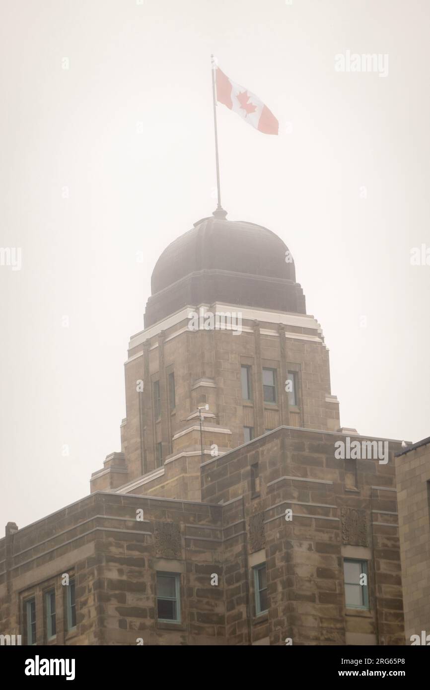 Canadian flag flying on top of a building in downtown Halifax Nova ...