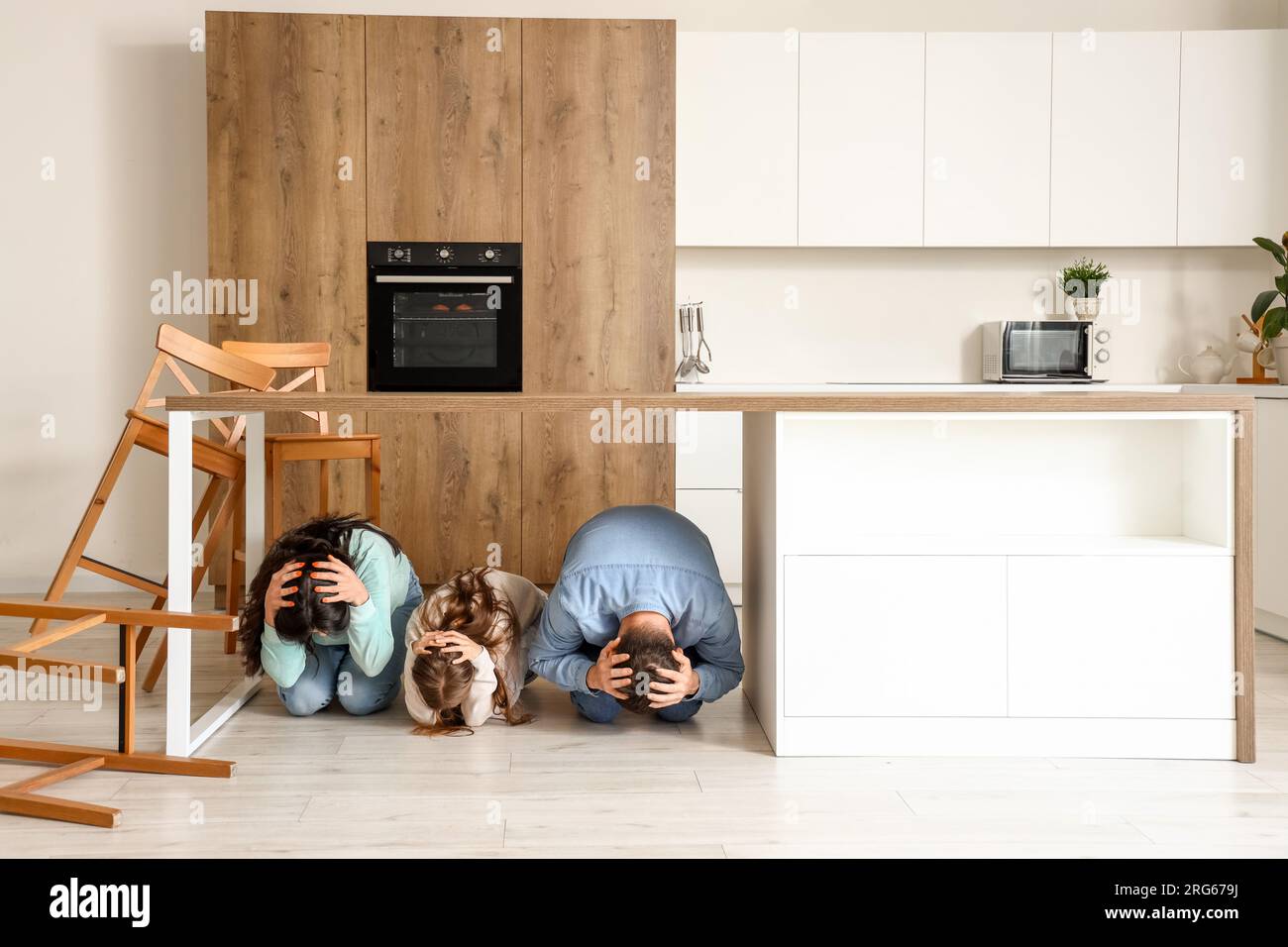 Girl hiding under table hi-res stock photography and images - Alamy